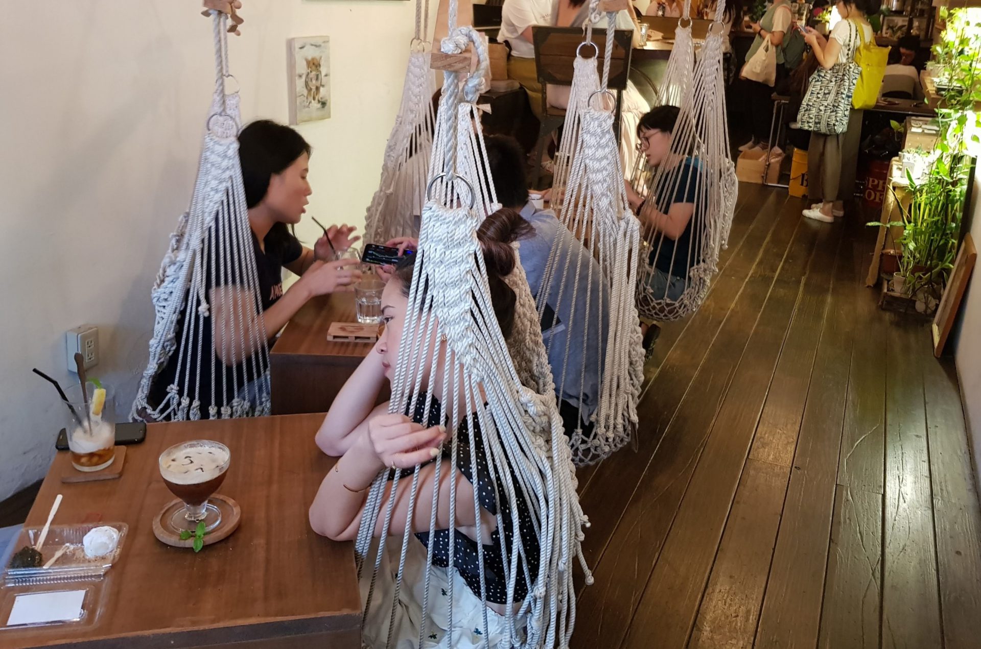 Swing in a Hammock Chair at Wengu Cafe - Taipei Travel Geek