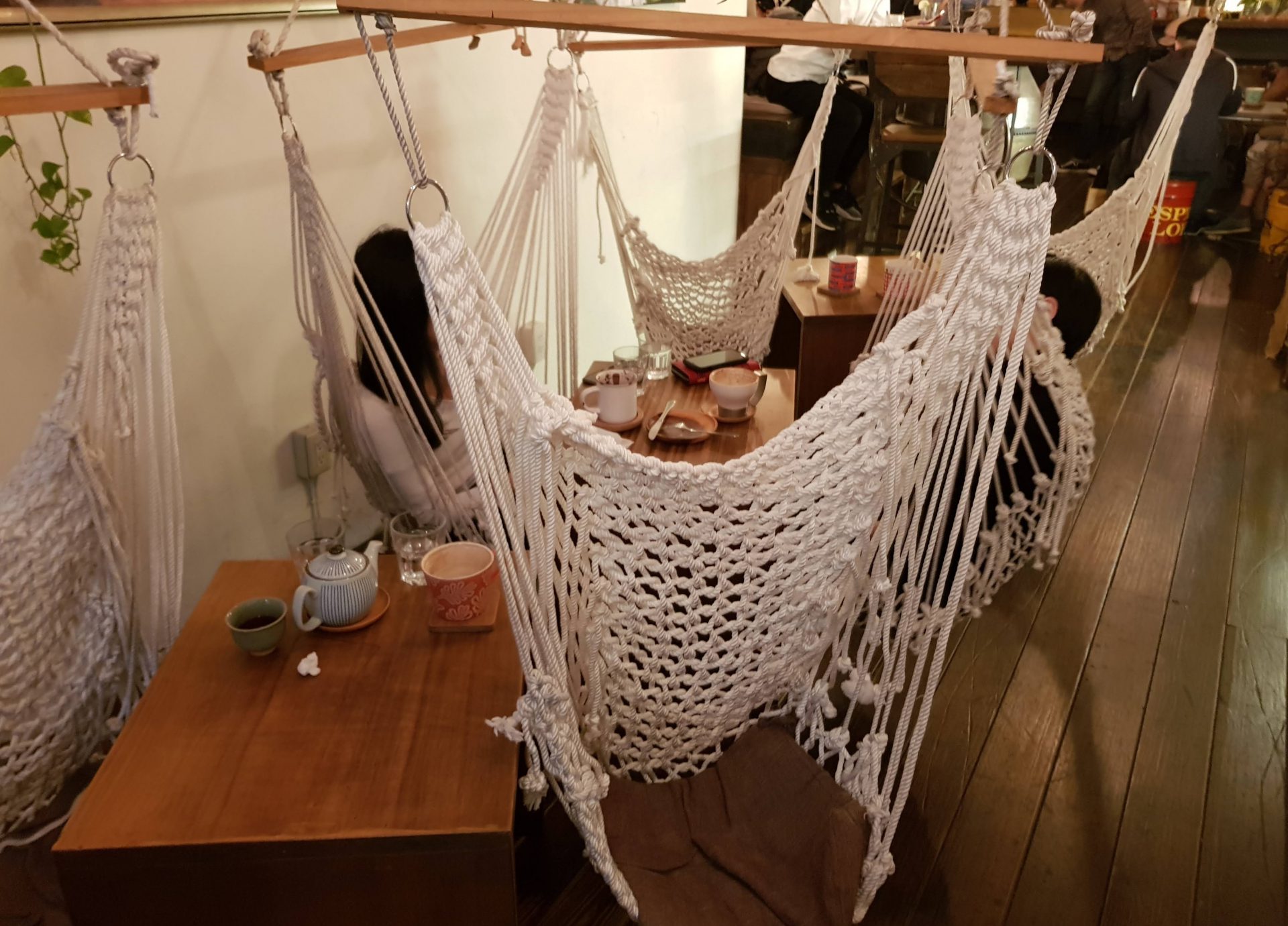 Swing in a Hammock Chair at Wengu Cafe - Taipei Travel Geek